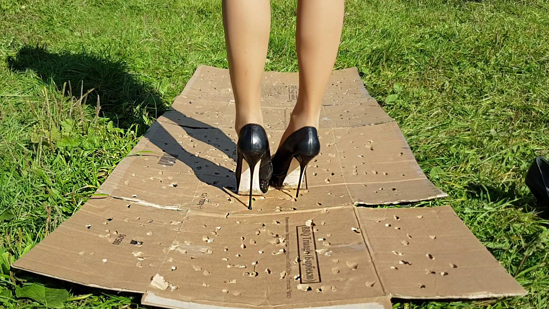 high heels crushing big piece of cardboard, cardboard crush, shoes ...